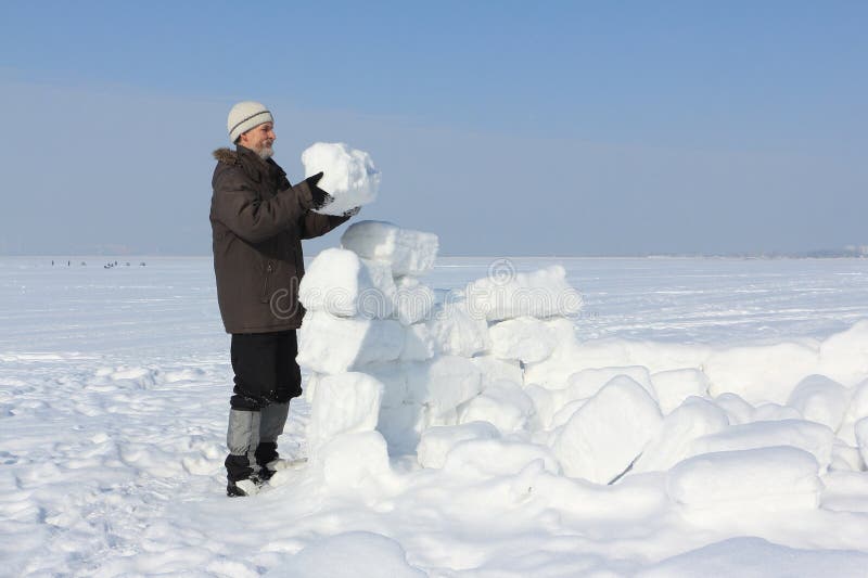 The man building a igloo stock photo. Image of haven - 50375864