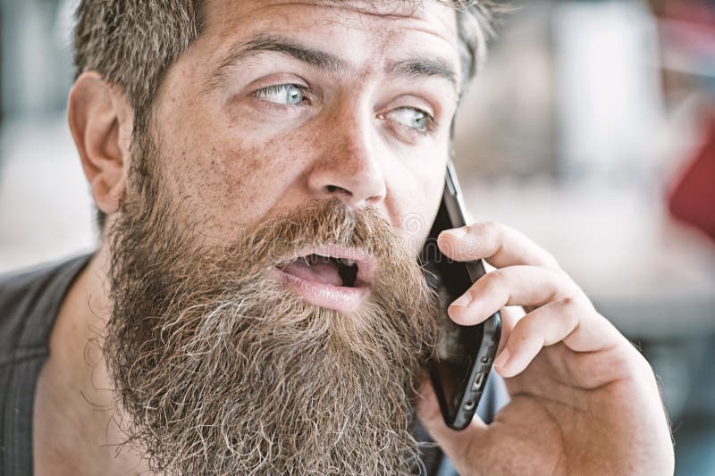 Man With Beard And Mustache Mobile Phone Conversation Defocused