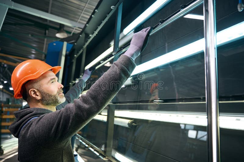 Middle-aged Man and a Female Colleague Work in Modern Laboratory Stock ...