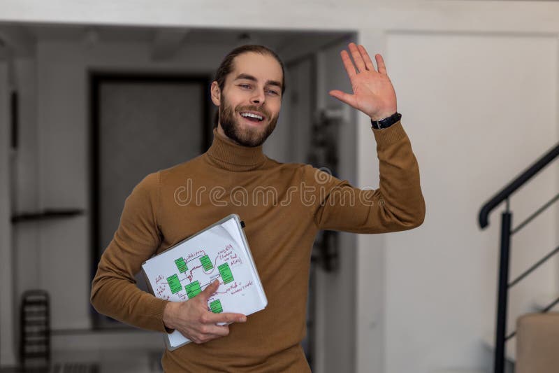 Man with Beard Standing Holding Paper Graph in Home Interior. Stock ...