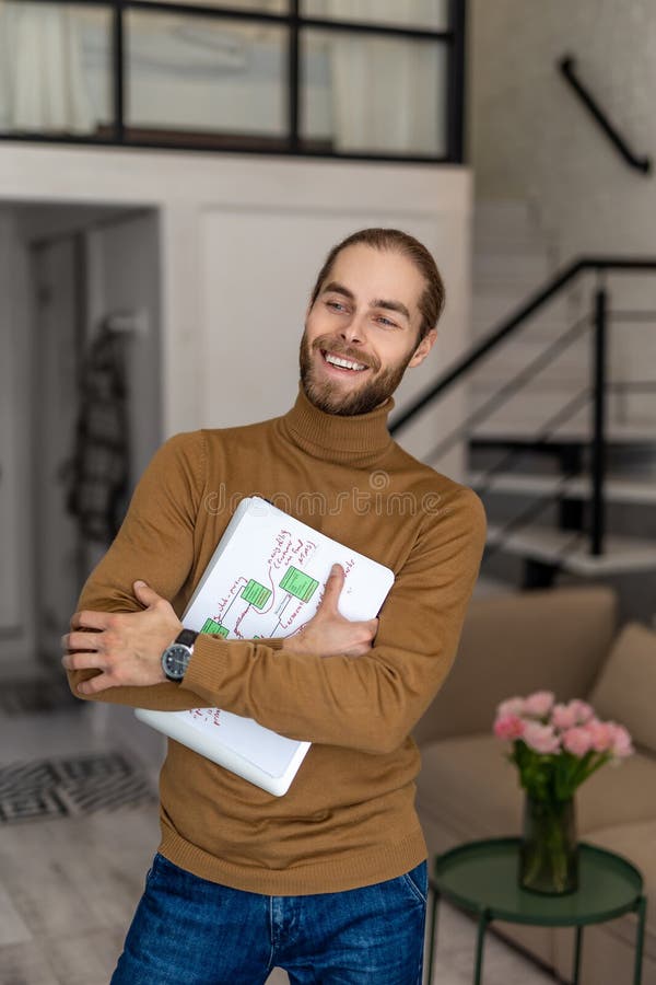Man with Beard Standing Holding Paper Graph in Home Interior. Stock ...