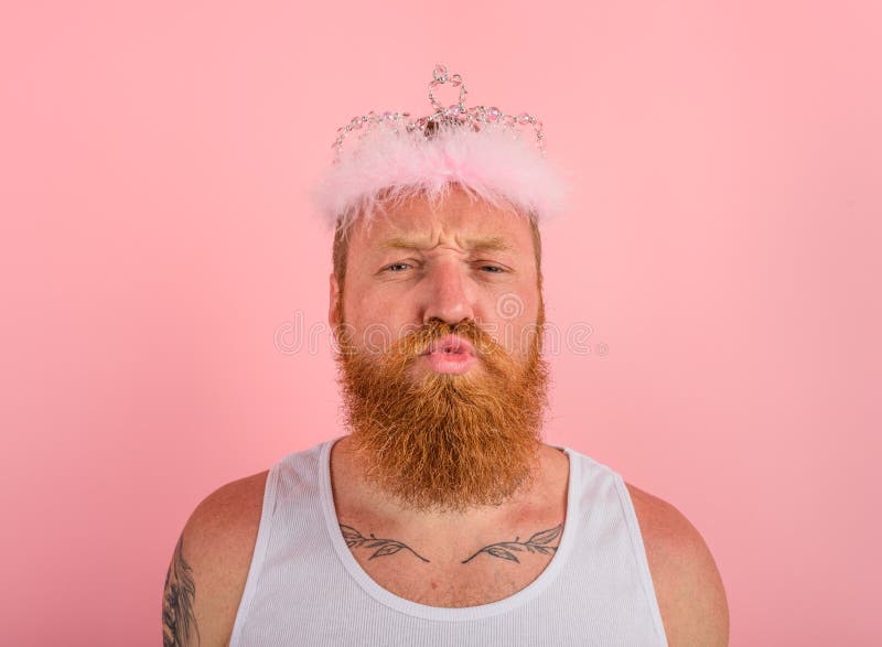 Man with Beard , Tattoos and Crown Acts Like a Princess Stock Image ...
