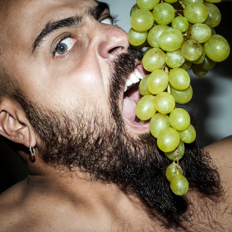 Man with Beard Who Eats Voraciously Grapes Stock Image - Image of anger ...