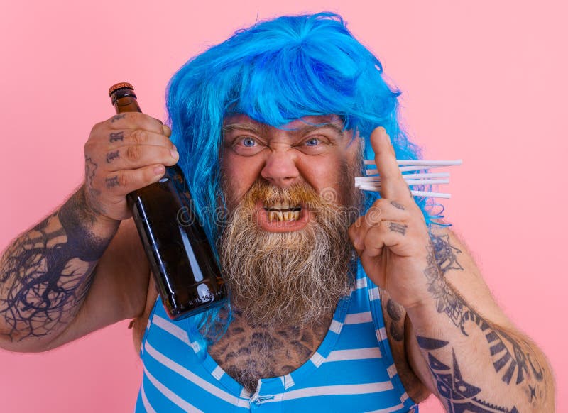 Fat Man with Beard and Wig Smokes Cigarettes and Drinks Beer Stock ...