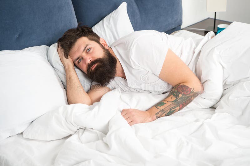 Man Bearded Hipster Having Problems with Sleep. Guy Lying in Bed Try To ...