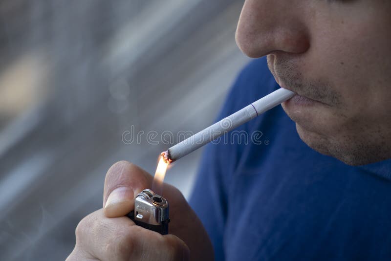 A Man Beats a Cigarette. the Beginning of Smoking. Cigarette in the ...