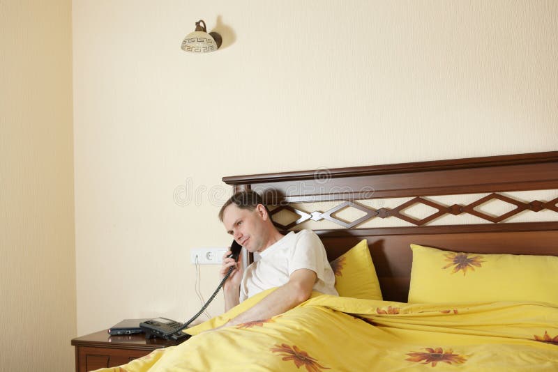 Man in Bed Calling by Phone Stock Photo - Image of person, lifestyles ...