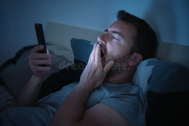 One Guy Texting On Cellphone Late At Night Stock Image - Image of dark ...