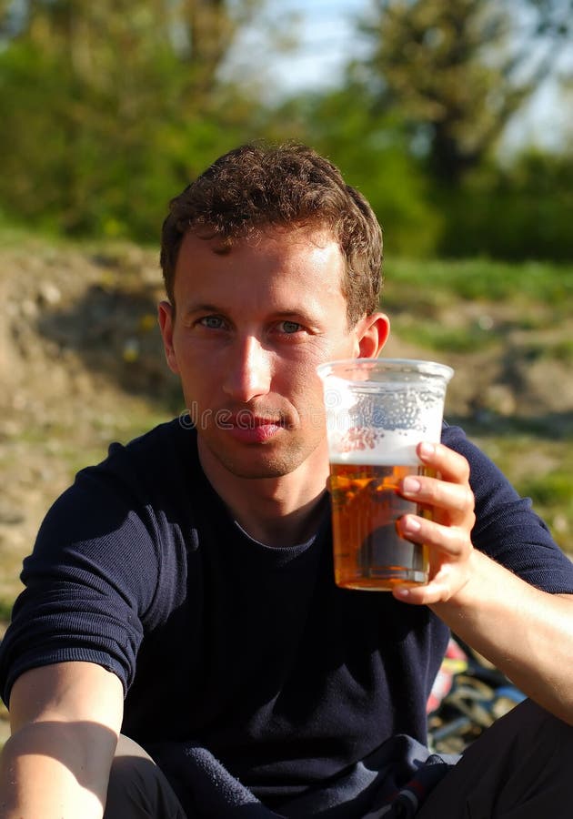 Man with beer stock image. Image of drink, hand, relax - 2384281