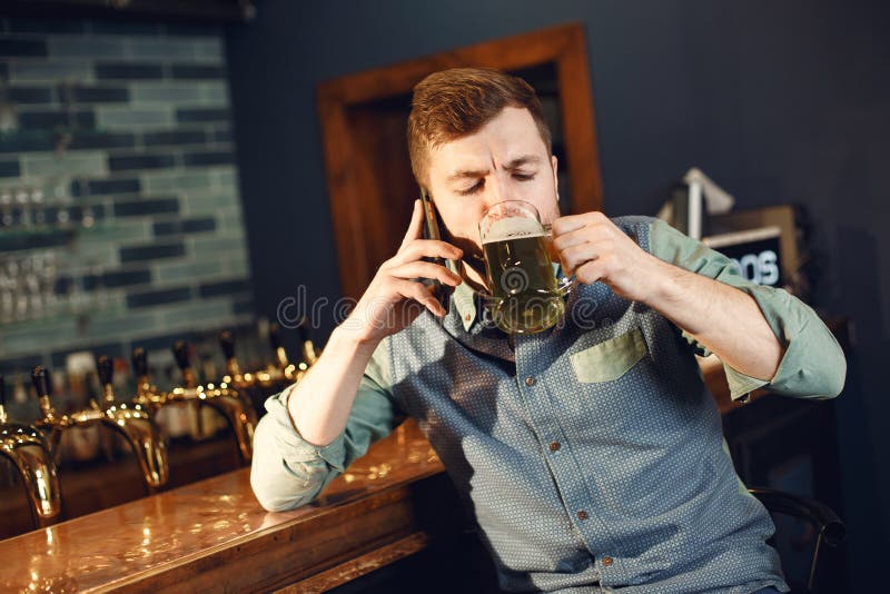 Man with Beer at Bar with a Phone Stock Photo - Image of leisure ...