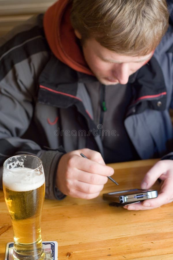 Man With Beer And Palm-size Computer Picture. Image: 1865918