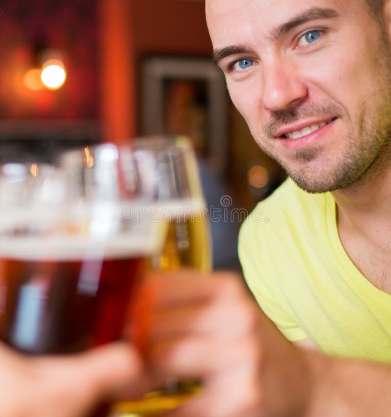 Man with beer in a pub stock image. Image of lifestyle - 38475487