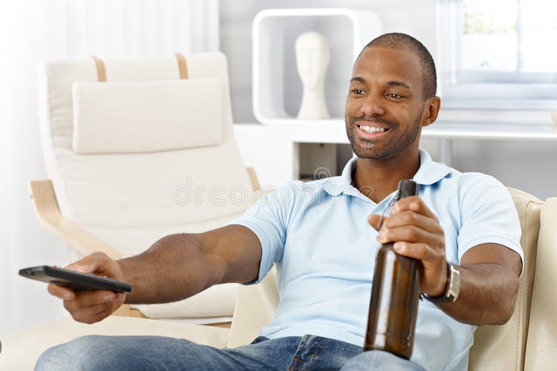 Man with Beer and Remote Control Stock Image - Image of enjoy, black ...