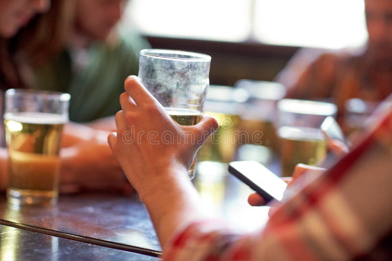Man with Beer and Smartphones at Bar or Pub Stock Image - Image of ...