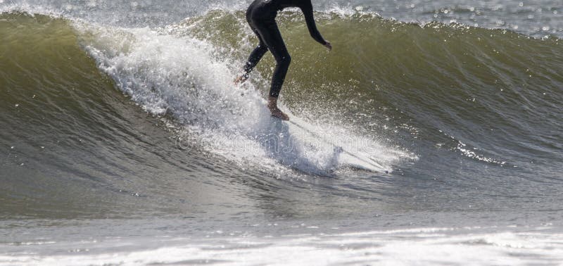 Man at the Beginning of Catching a Wave while Surfing Stock Image ...