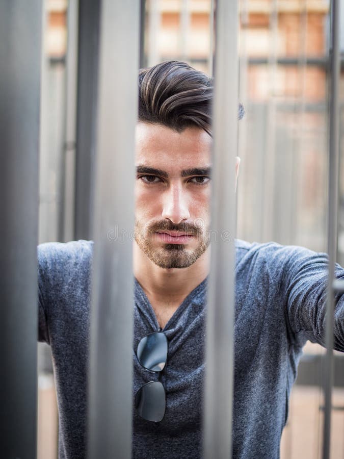 Man behind bars stock image. Image of portrait, confidence - 176847287