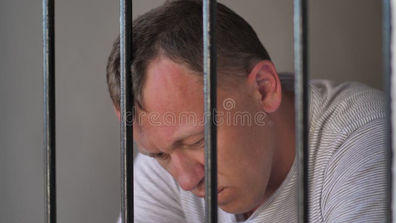 Man Behind Bars in Prison is Thinking about Something, a Bad Emotion ...