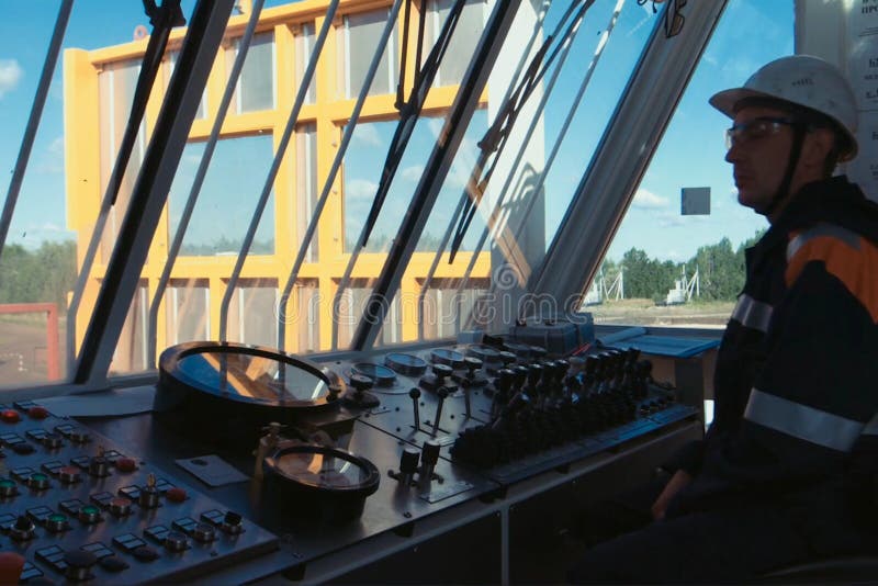 The Man Behind the Control Panel. Levers for Controlling Hydraul ...