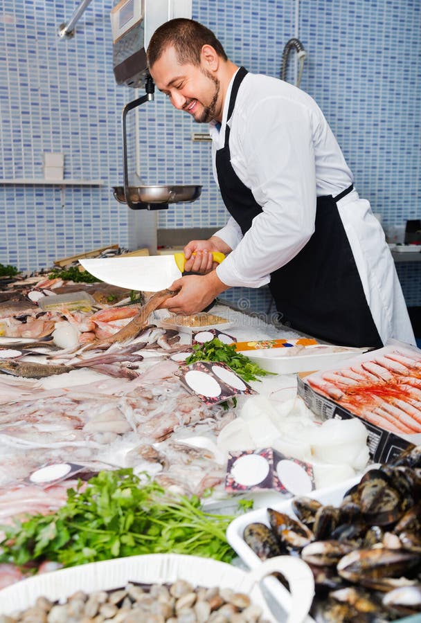 Man Behind Counter Cut Off Piece of Fish Stock Image - Image of hake ...