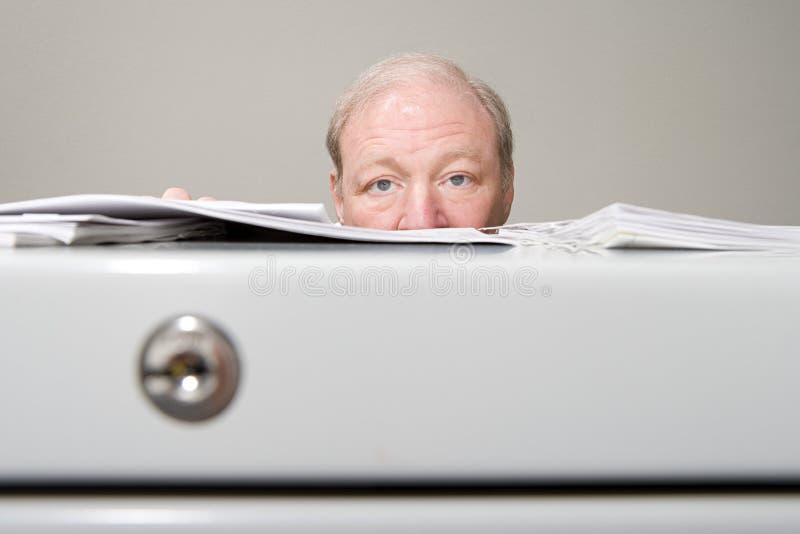 Man behind filing cabinet stock photo. Image of head - 62558952