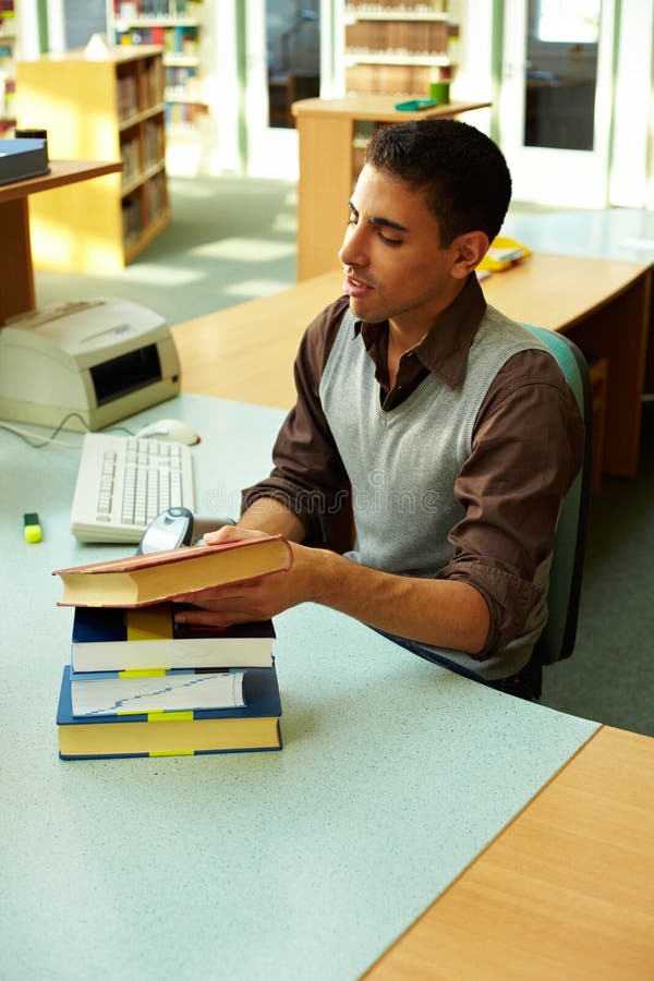 Man behind library counter stock photo. Image of male - 11860242
