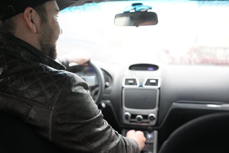 Man Driving a Car in the Process Stock Photo - Image of taxi, jacket ...