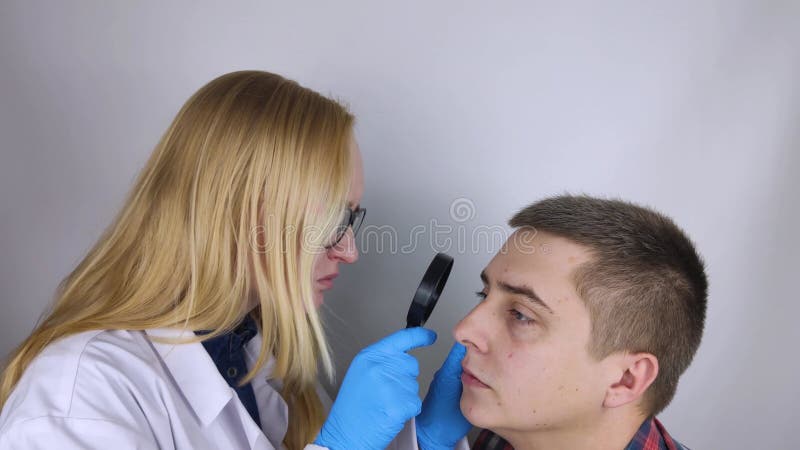 Close Up Of Doctor Dermatologist Examines A Birthmark Of Patient