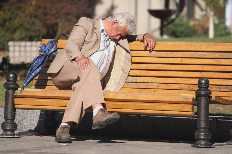 Man on bench stock photo. Image of umbrella, park, relax - 3441476