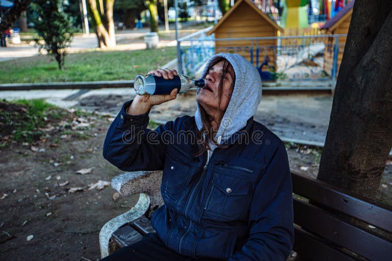 Man on Bench is Drinking Alcohol. Alcohol Addiction Concept Stock Image ...