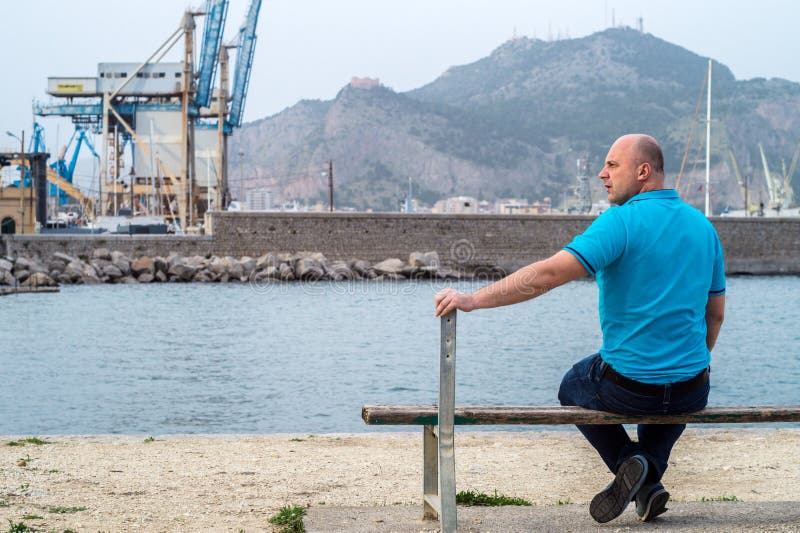 Man on bench stock image. Image of looking, harbor, nature - 48222537
