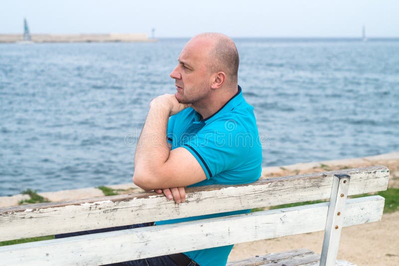 Man on bench stock image. Image of blue, mountain, seat - 48225073