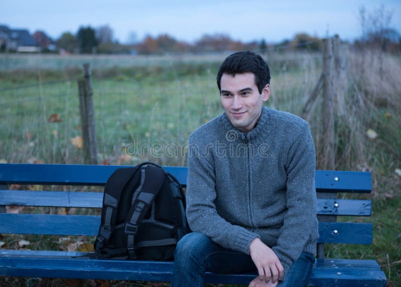 Man on bench stock photo. Image of caucasian, fence, sitting - 67369528