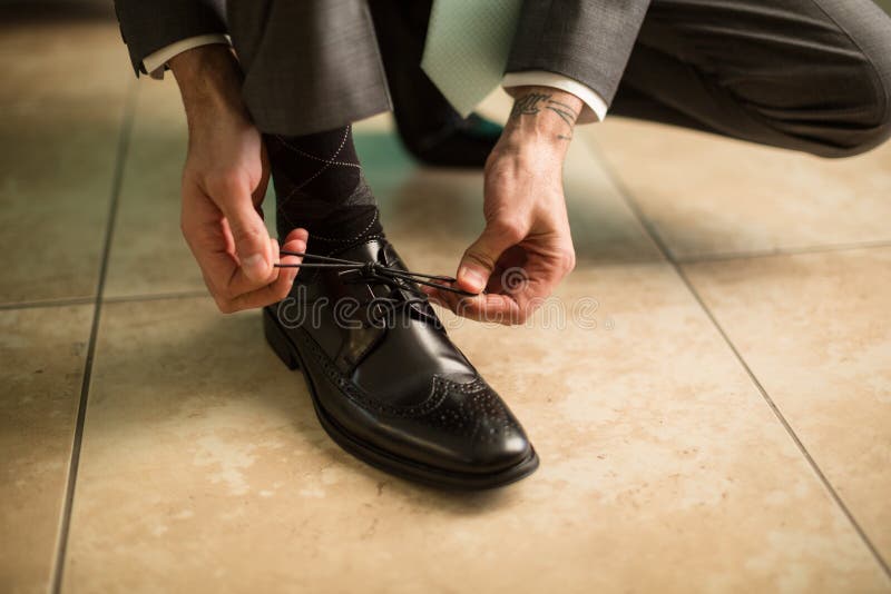 Man tying shoe stock image. Image of groom, bending - 230080821
