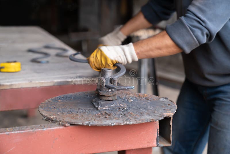 Man Bends Metal Part Creating Curved Shape Using Special Machine ...