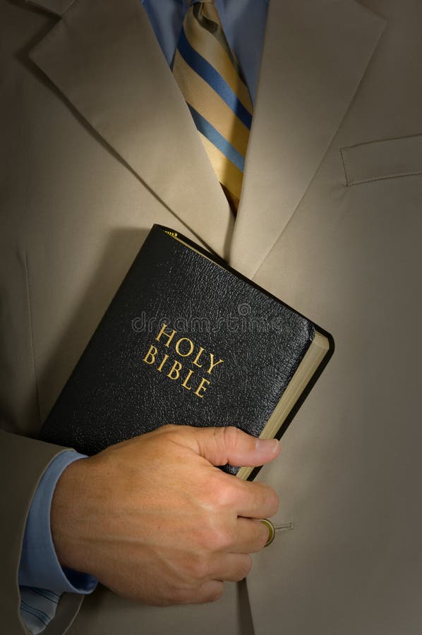 Man HOlding Bible stock image. Image of reading, clothing - 2968481