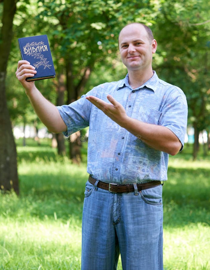 Man with a Bible in His Hand Stock Image - Image of faith, park: 74952833