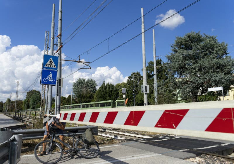 A Man on a Bicycle Crosses the Train Tracks Editorial Image - Image of ...