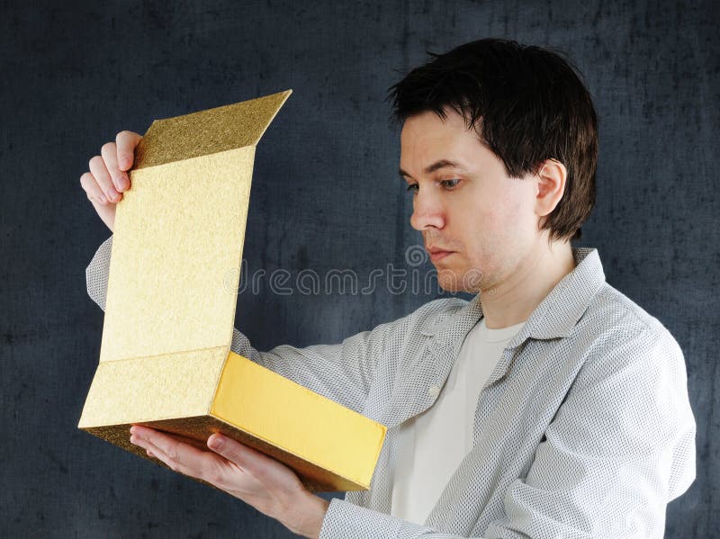 Man with big golden box. stock photo. Image of looking - 18000962