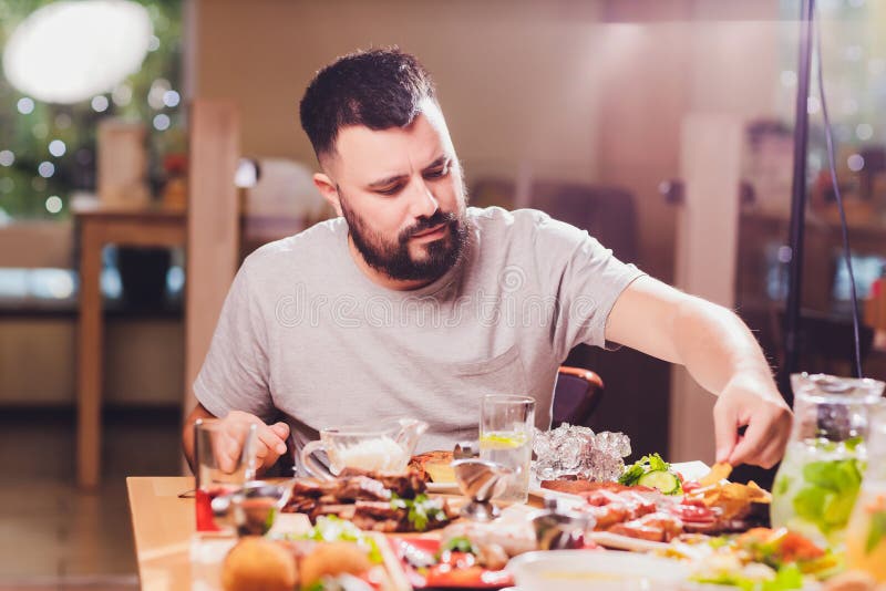 Man at the Big Table with Food. Stock Image - Image of person ...