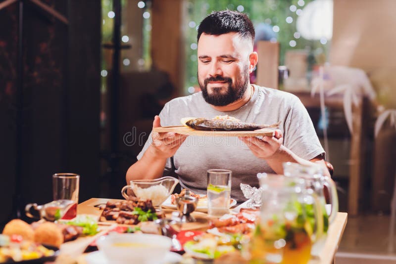 Man at the Big Table with Food. Stock Image - Image of party, family ...