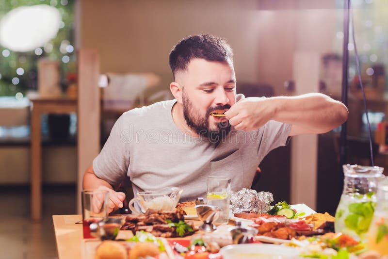 Man at the Big Table with Food. Stock Image - Image of eating, family ...