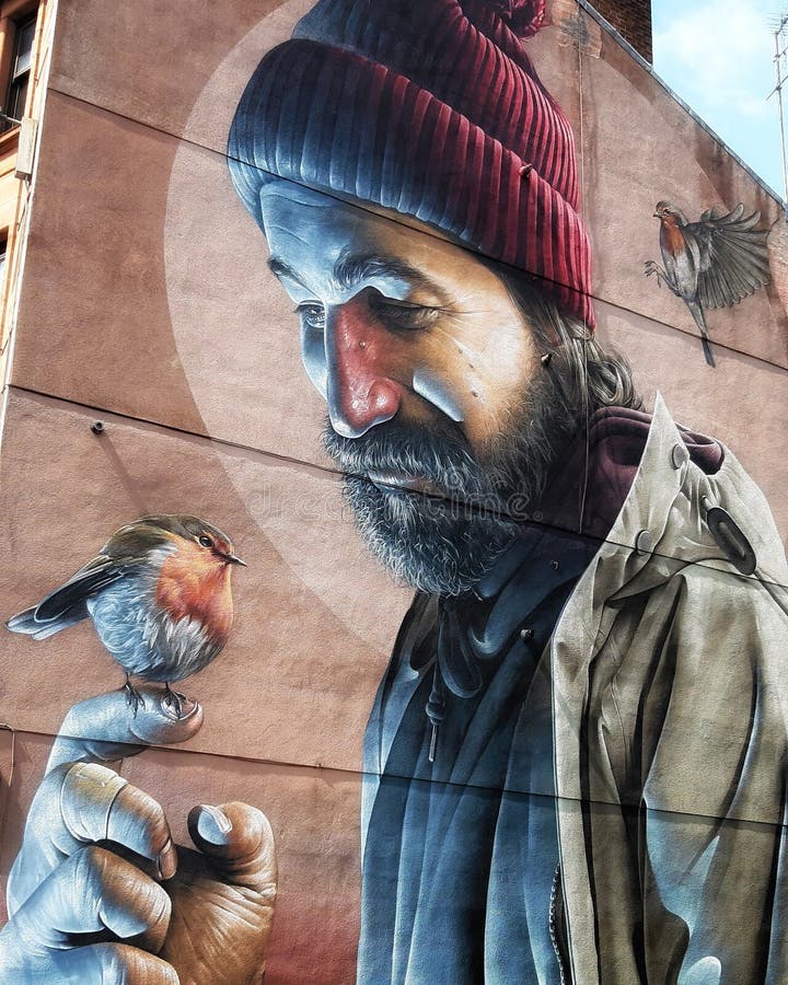 Man and bird editorial image. Image of glasgow, streetart - 154991925