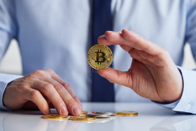 Man with Bitcoin Coins Behind the Desk Stock Photo - Image of money ...