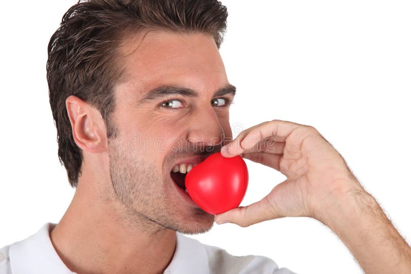 Man Biting Heart Shaped Object Stock Photos - Free & Royalty-Free Stock ...