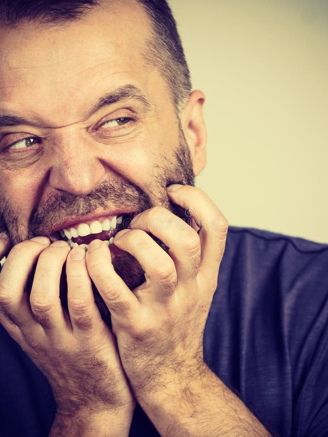 Man biting his nails stock image. Image of anxiety, nail - 144022979