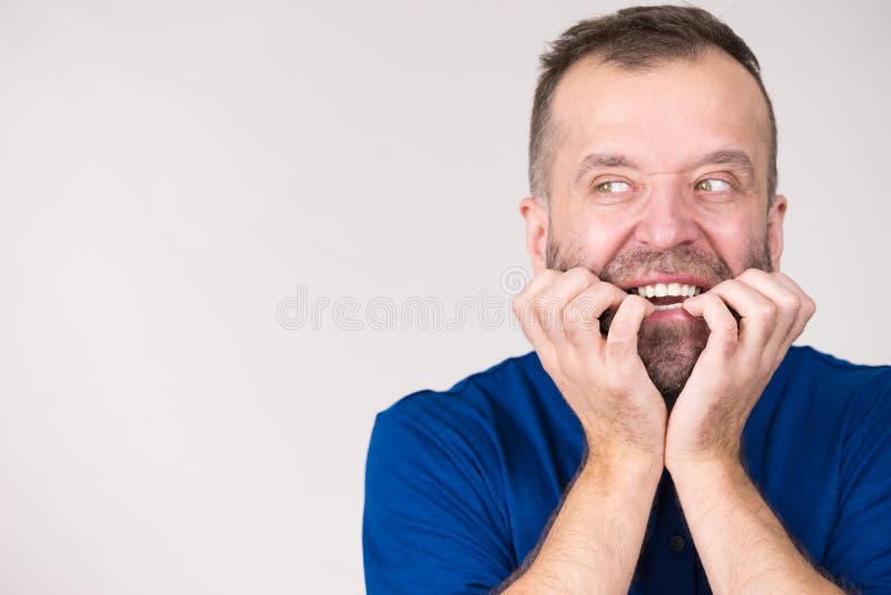 Man biting his nails stock photo. Image of nervous, nail - 182645406