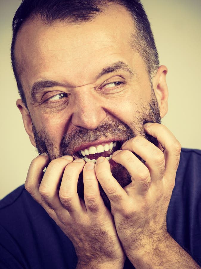 Man biting his nails stock photo. Image of fear, bite - 209868430