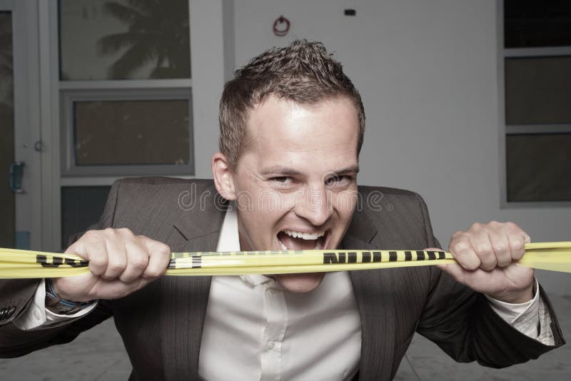 Man Biting through the Tape Stock Photo - Image of grab, tearing: 11714348