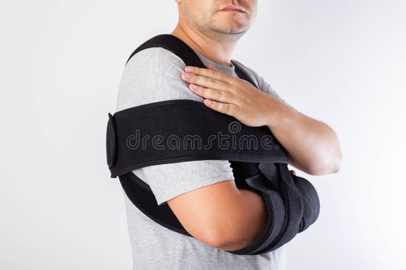A Man in a Black Bandage Supporting the Shoulder Joint after Ligament ...