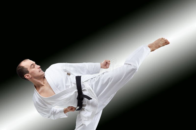 A Man with a Black Belt Strikes a High Kick Stock Image - Image of self ...